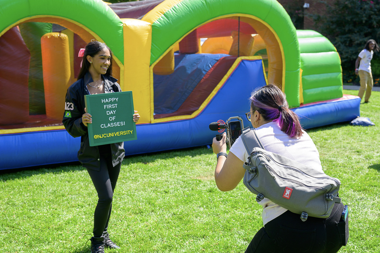 Student holding Happy First Day of Classes sign | New Jersey City ...